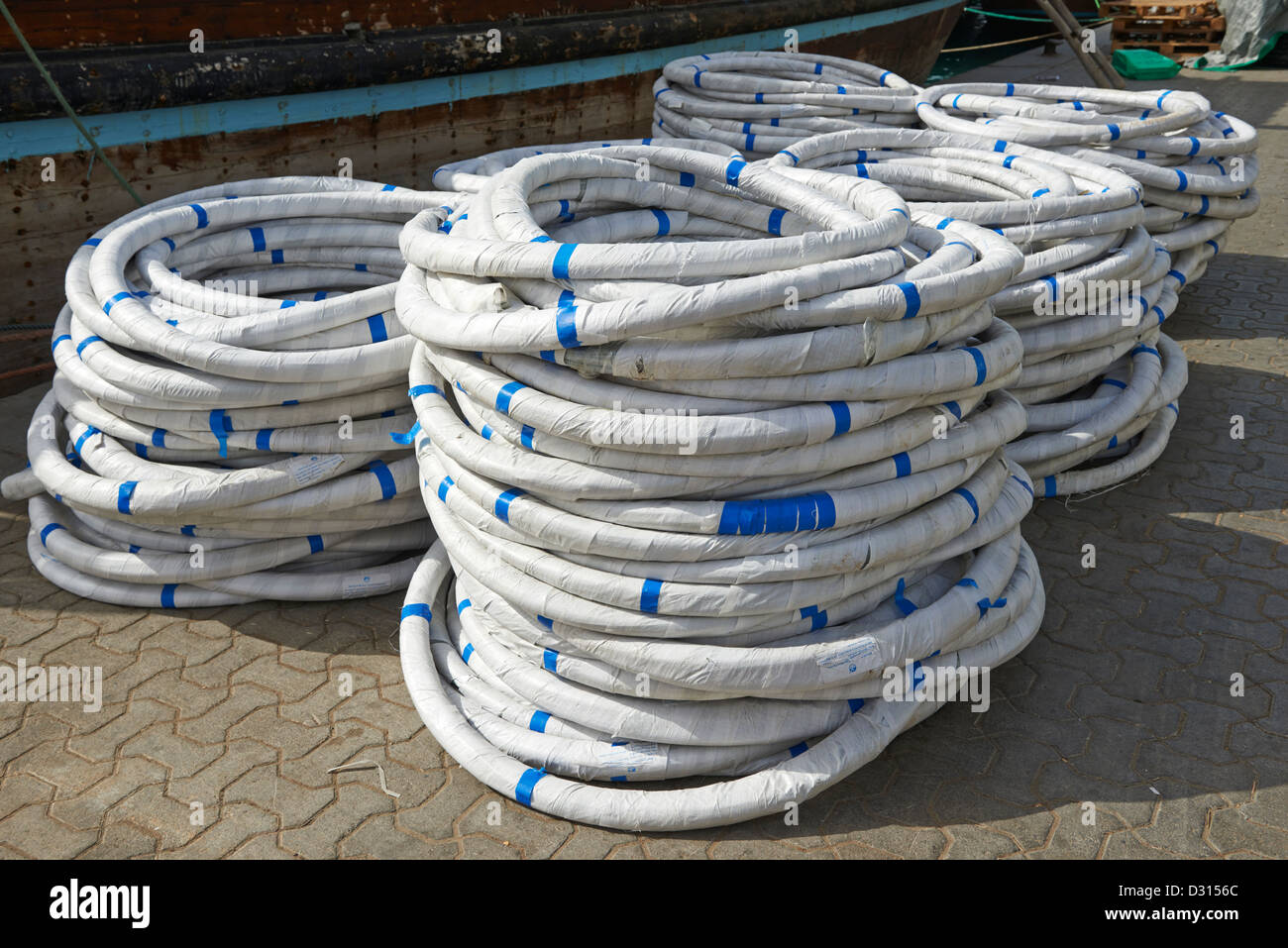 Wrapped tubes of metal and plastic lines and strips Stock Photo - Alamy