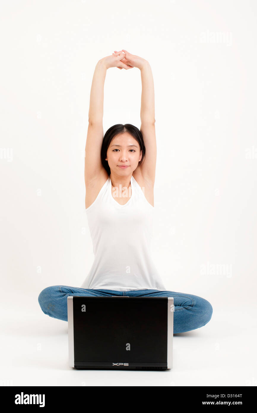 Chinese woman makes stretching Stock Photo - Alamy
