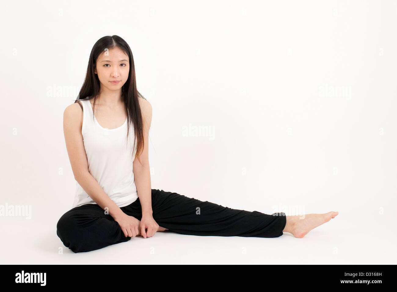Chinese woman doing yoga Stock Photo - Alamy