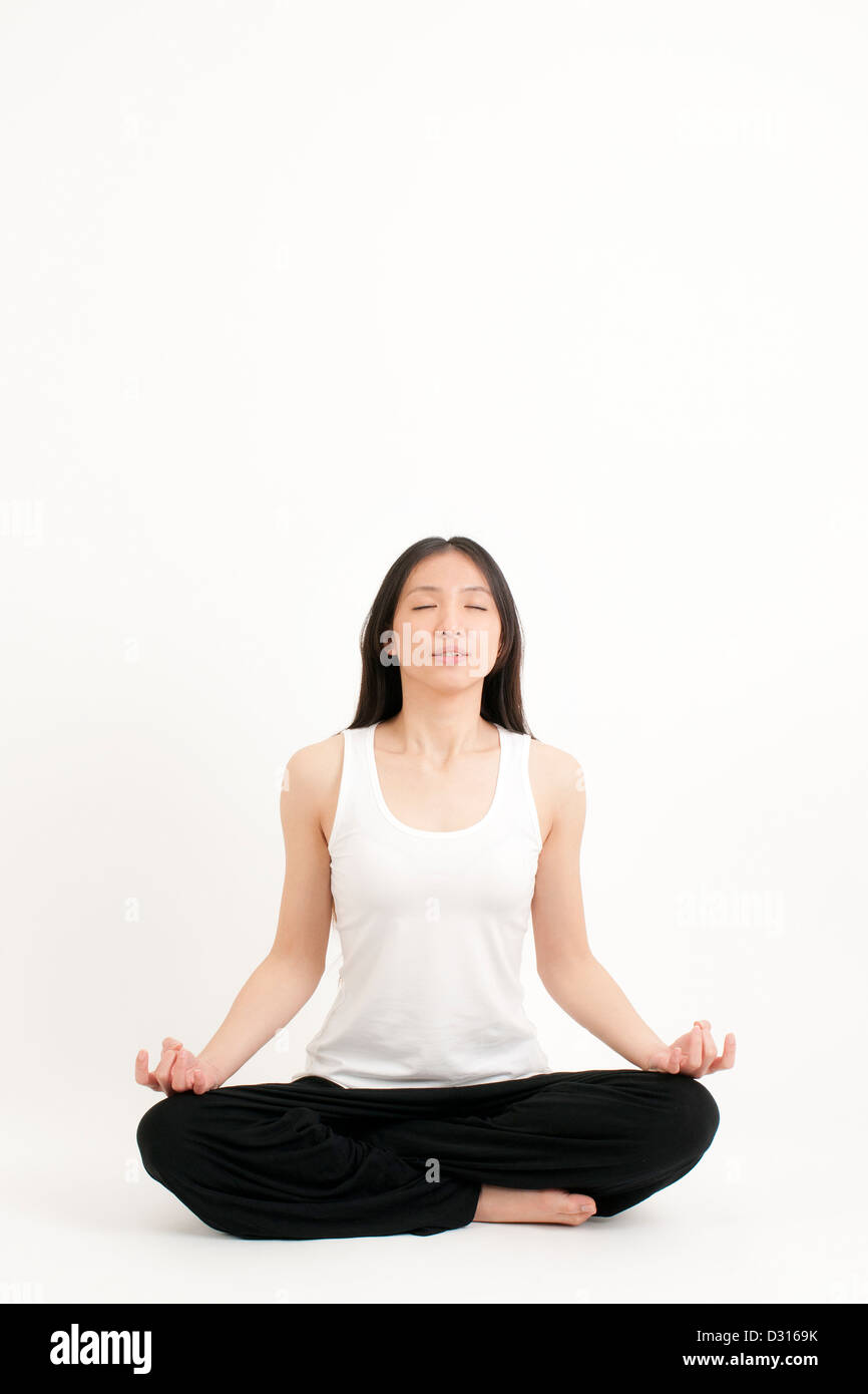 Chinese woman doing yoga Stock Photo - Alamy