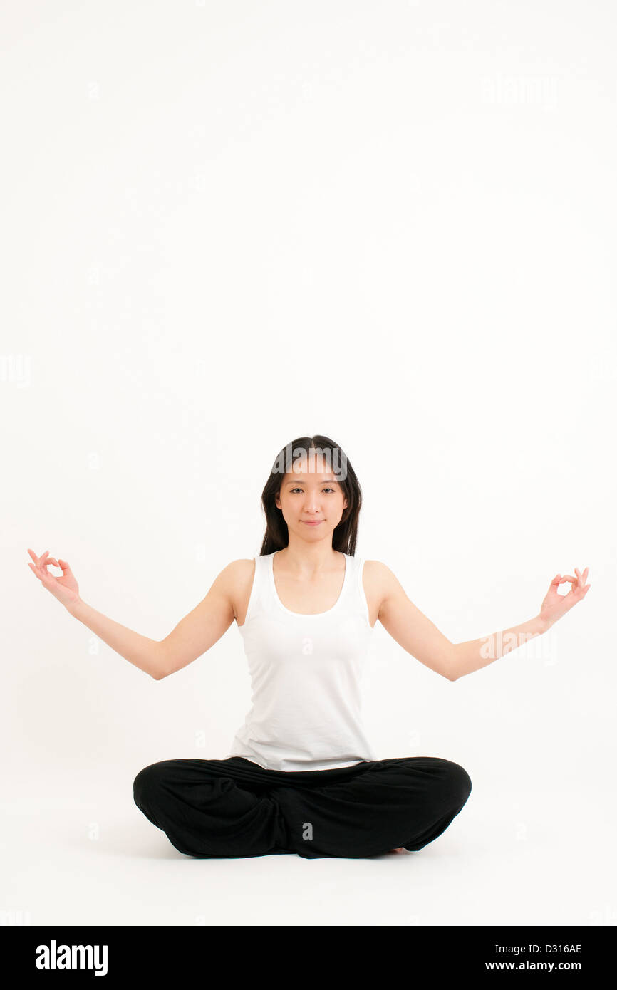Chinese woman doing yoga Stock Photo - Alamy