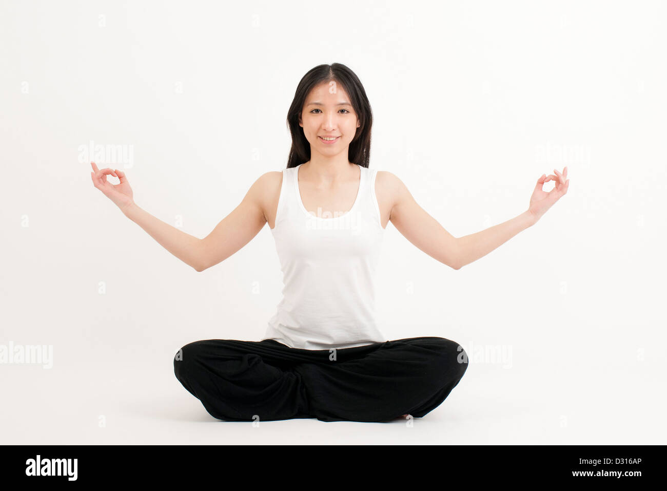 Chinese woman doing yoga Stock Photo - Alamy