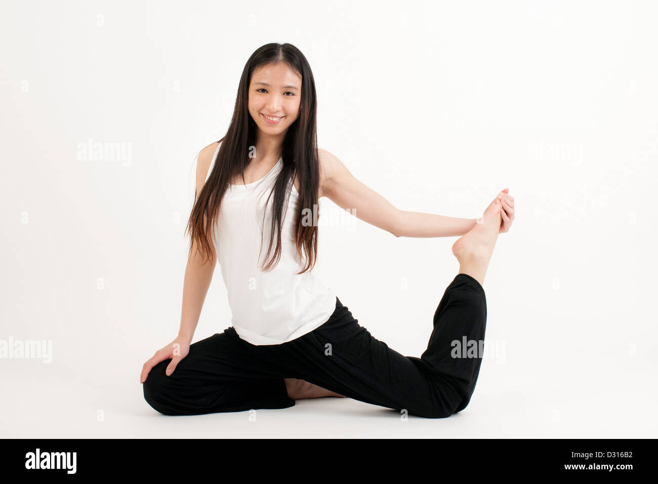 Chinese woman doing yoga Stock Photo - Alamy