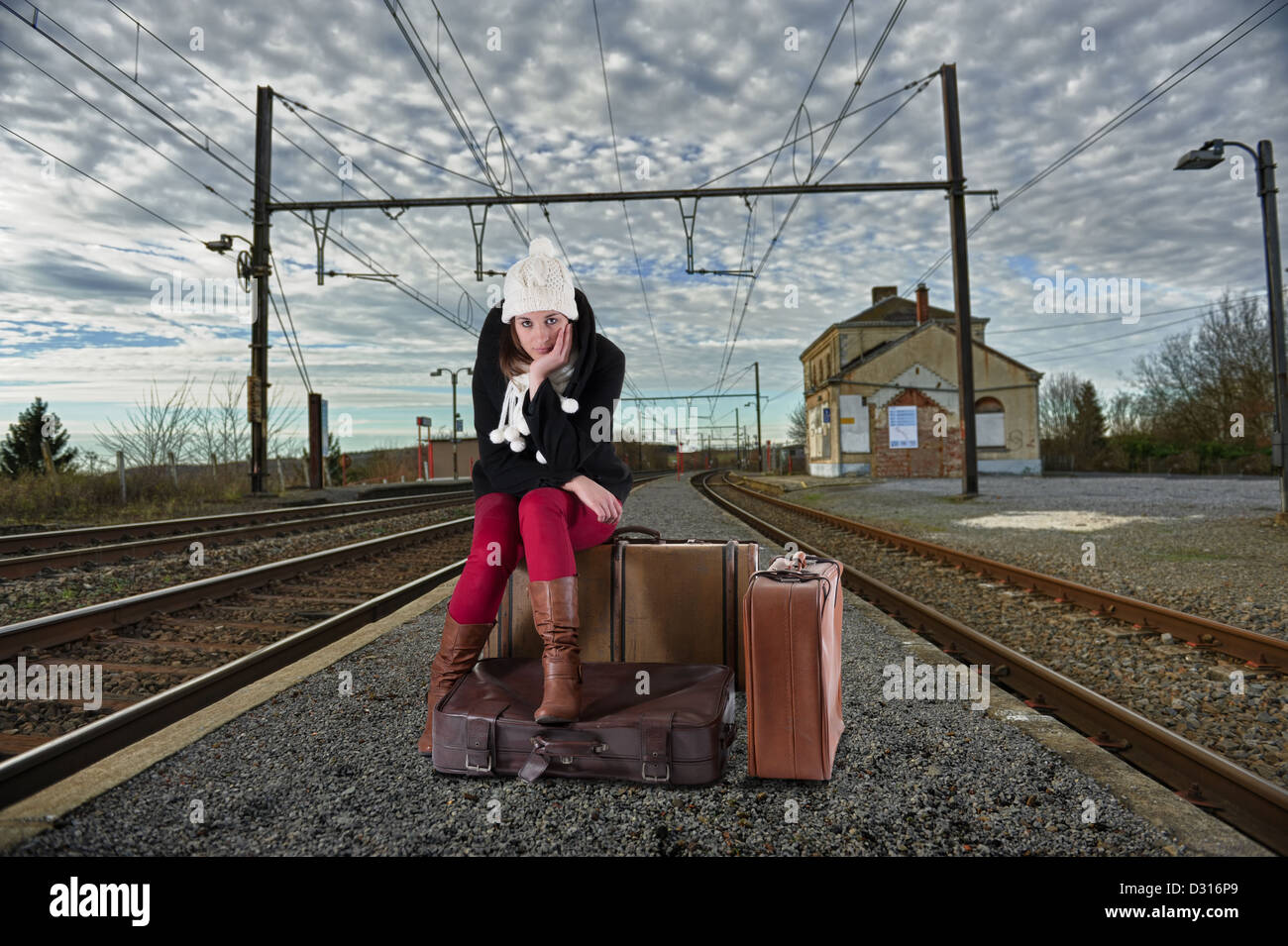 bored young woman waiting for her train Stock Photo - Alamy