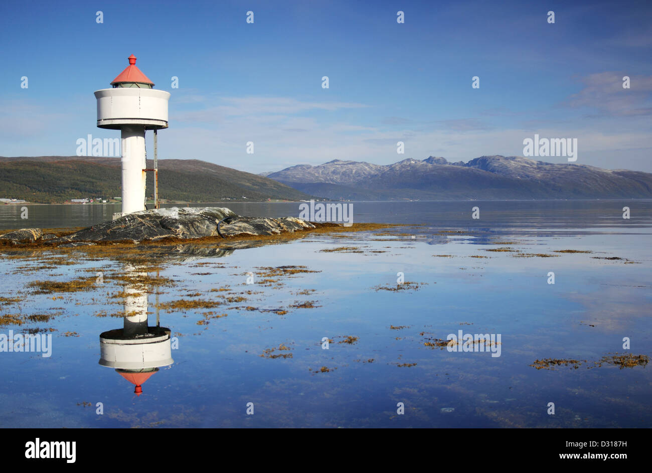 Little white lighthouse in the Norwegian fjords Stock Photo - Alamy