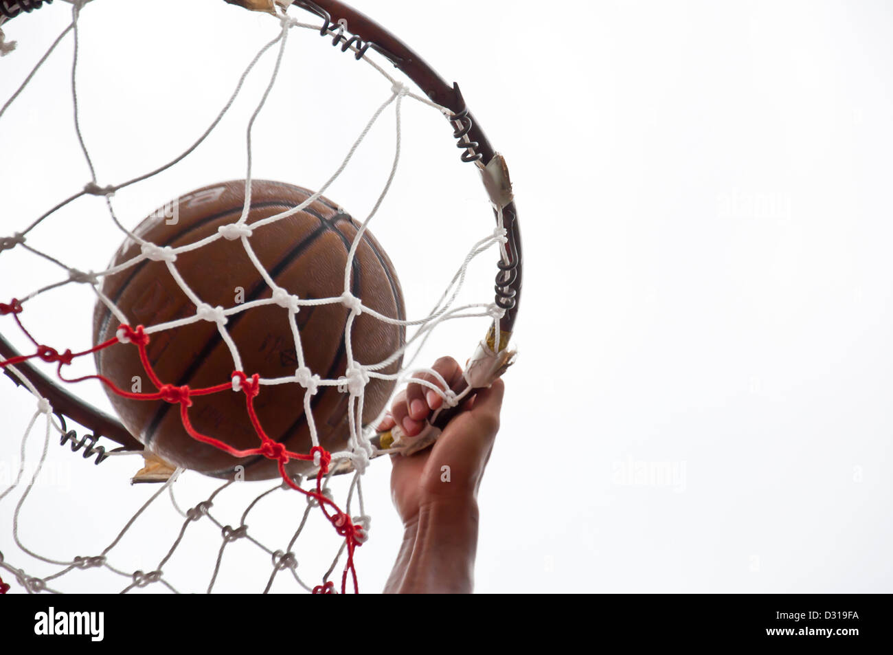 ball in hoop of basketball from dunk Stock Photo - Alamy