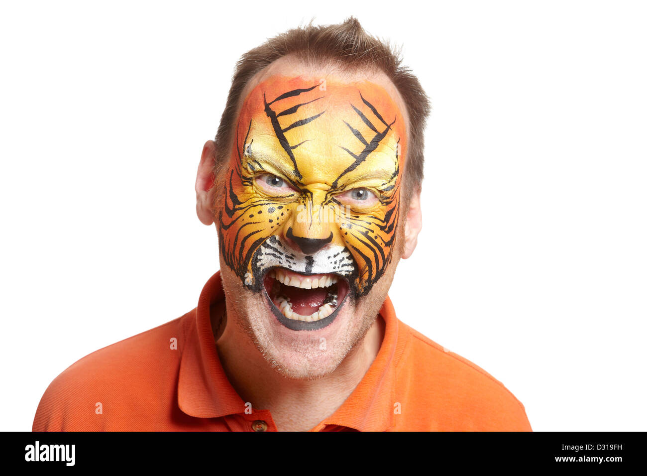 Man with face painting tiger smiling on white background Stock Photo ...