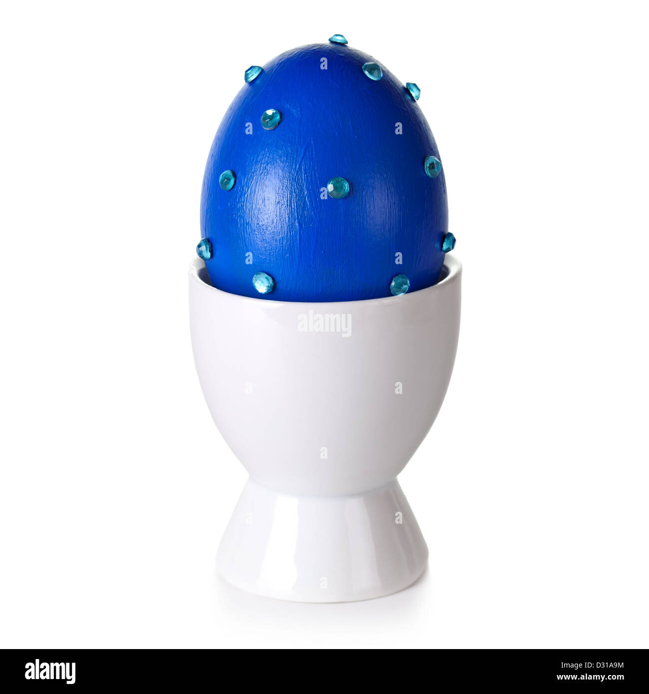 Easter egg on stand on white background. Blue eggshell hand decorated ...