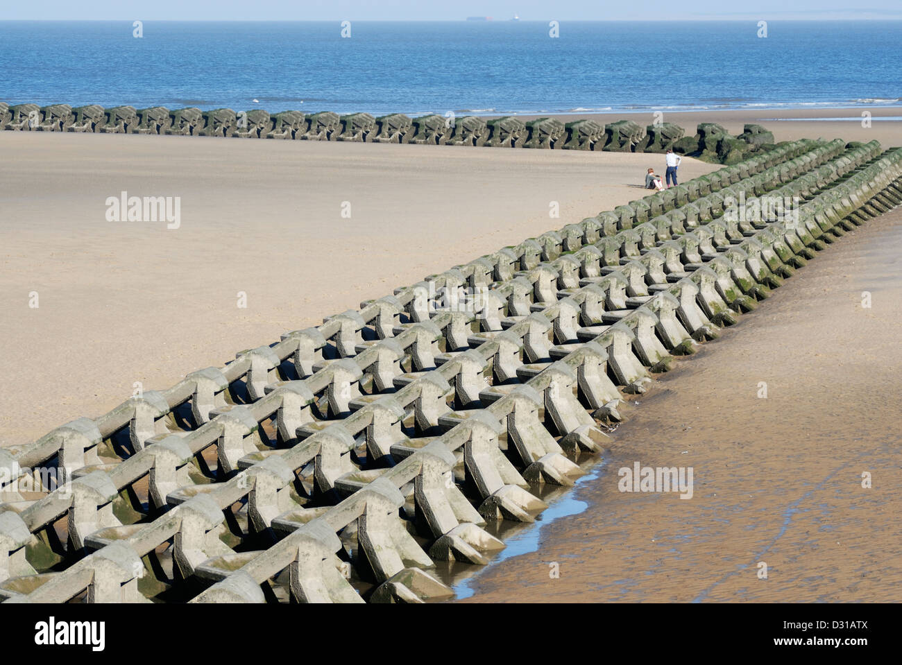 Concrete groynes on New Brighton beach on the Wirral Stock Photo - Alamy