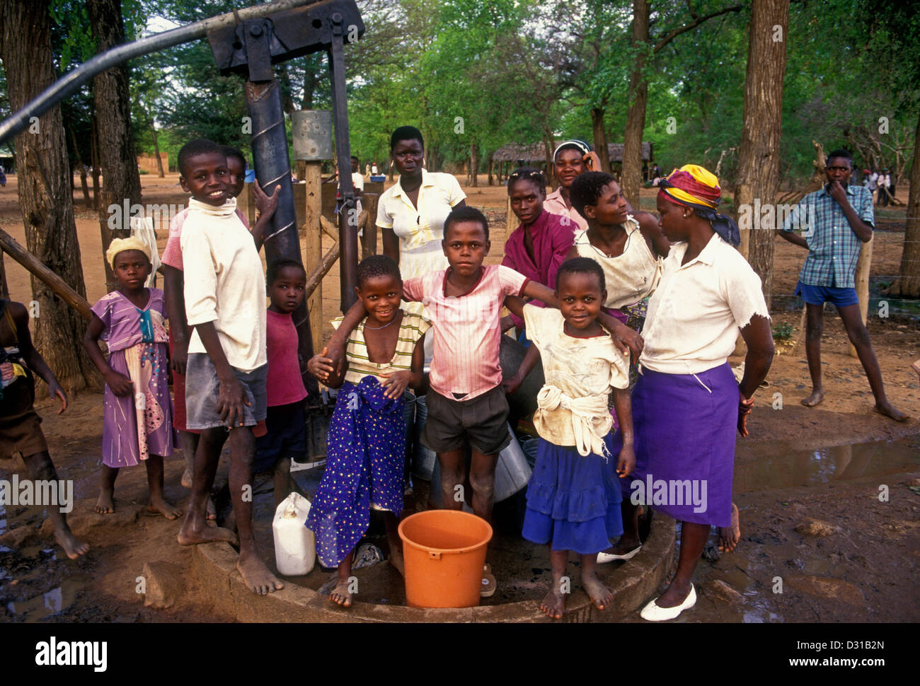 Zimbabwean people, women and children, pumping water from well, water ...