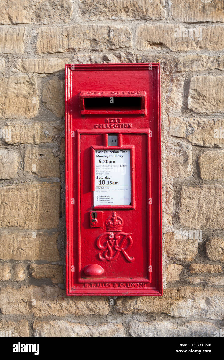 British red letter box on cotswold stone wall, Worcestershire, England ...