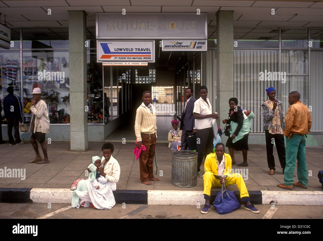Zimbabweans, people, waiting for bus, bus stop, town of Chiredzi ...