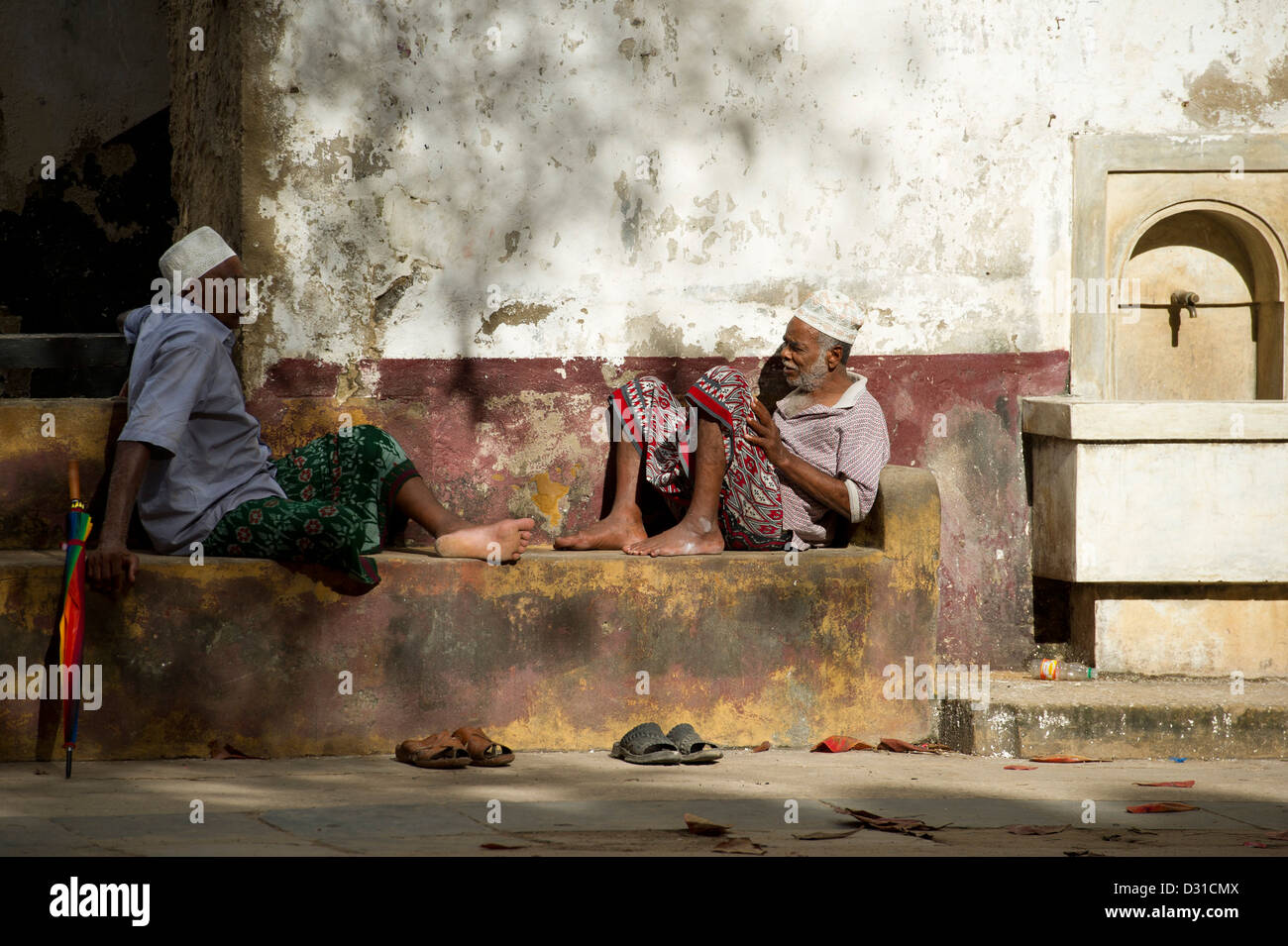 Muslim men talking on the main square, Lamu, Lamu Archipelago, Kenya ...