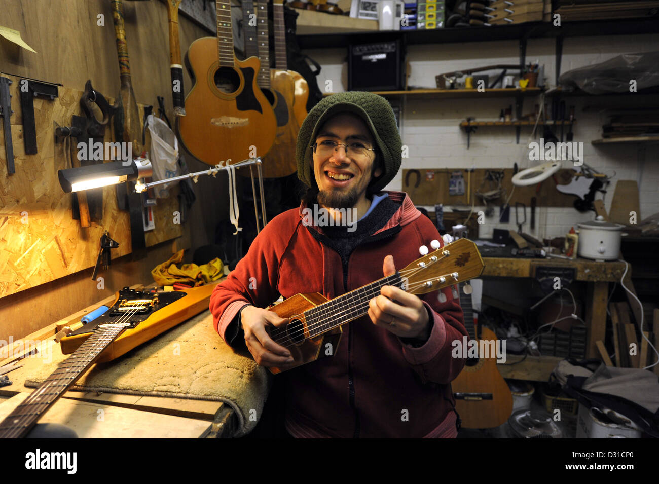 Tim Lloyd repairs and builds guitars and ukuleles at his workshop at ...