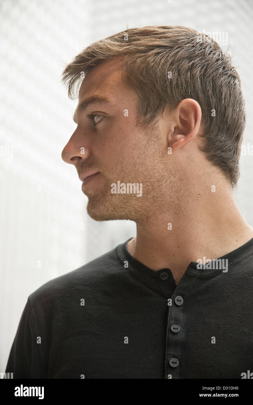 Portrait in profile of a good looking young guy Stock Photo - Alamy