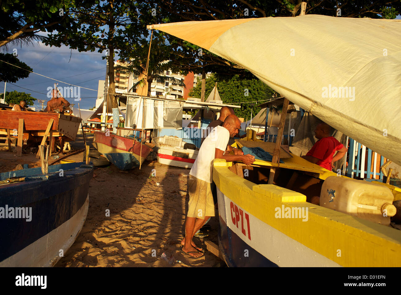still working ,fixing boats Stock Photo - Alamy