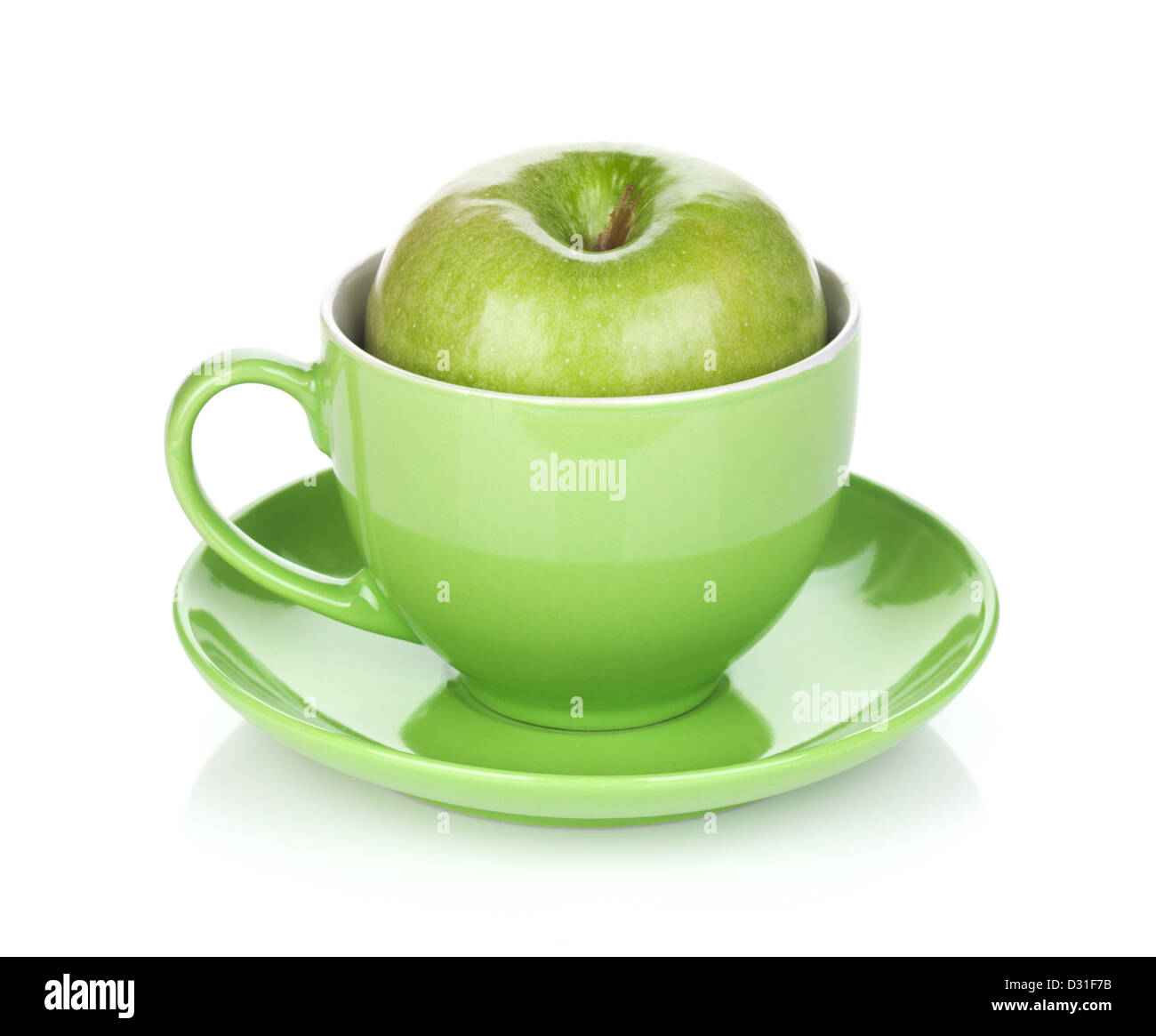 Ripe green apple in tea cup. Isolated on white background Stock Photo ...