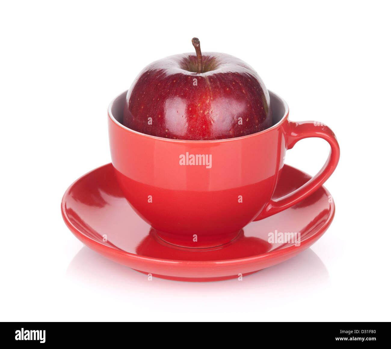 Ripe red apple in tea cup. Isolated on white background Stock Photo - Alamy