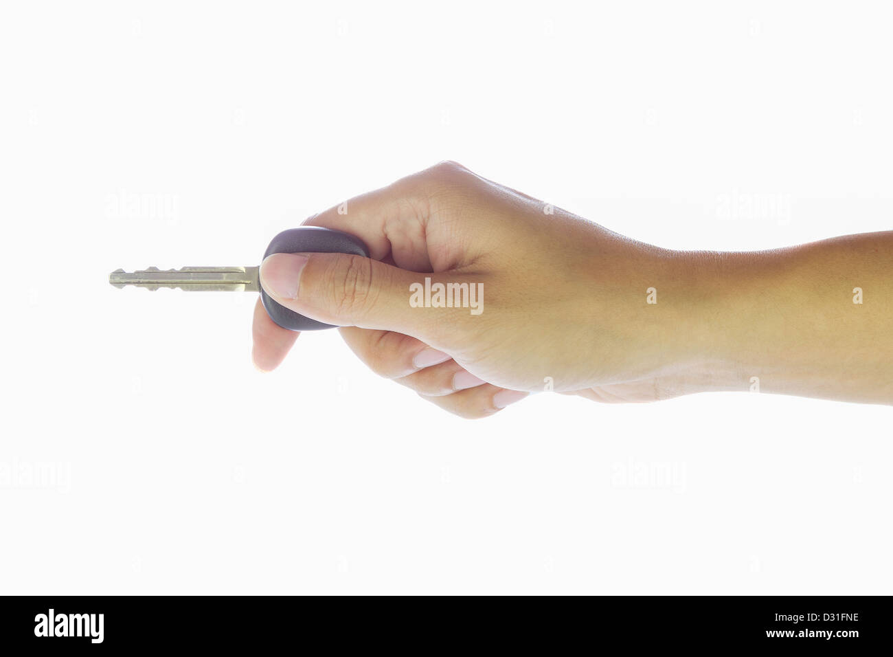 Car keys in hand, isolated on white Stock Photo - Alamy