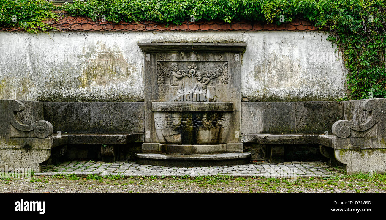 Well and bench of stone Stock Photo - Alamy