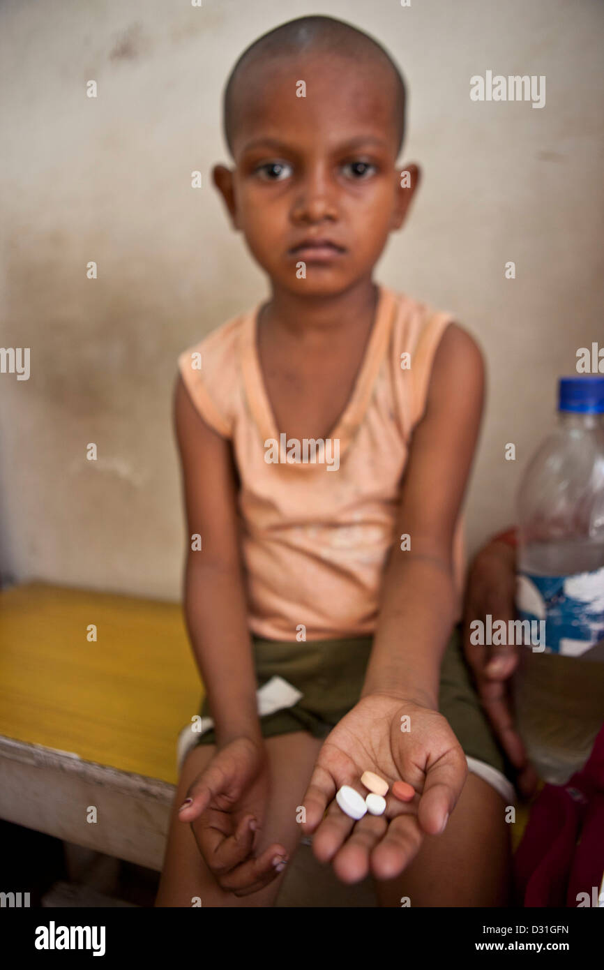 Indian child is given her daily medication tablets for Tuberculosis (TB ...