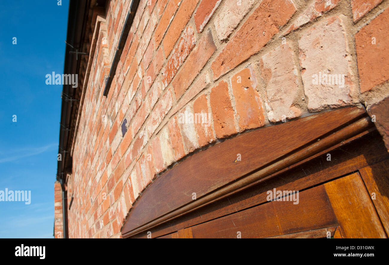 Arched brickwork over a window on a newly renovated barn in rural ...