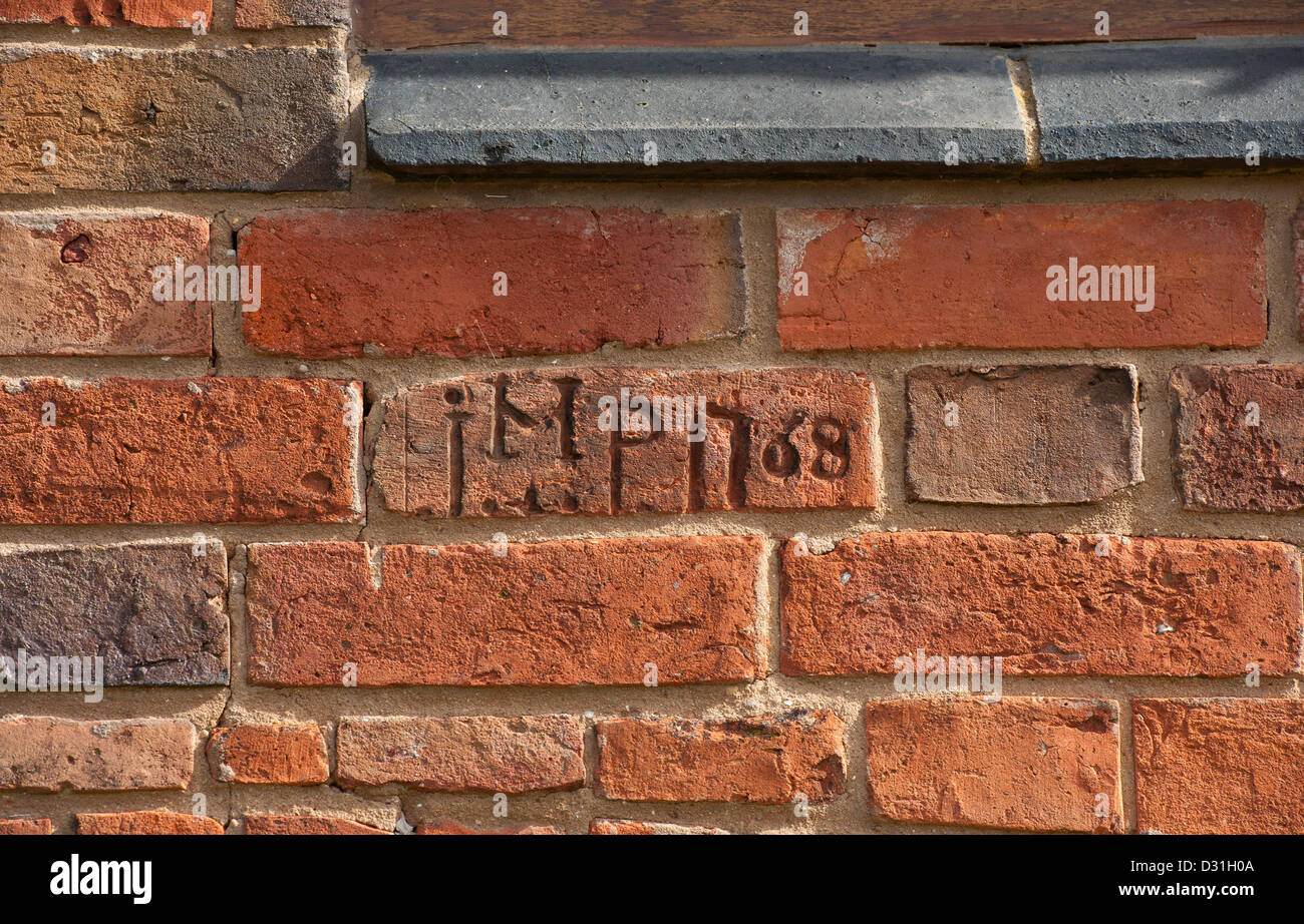 Initials and date etched into brickwork on a newly renovated barn in ...