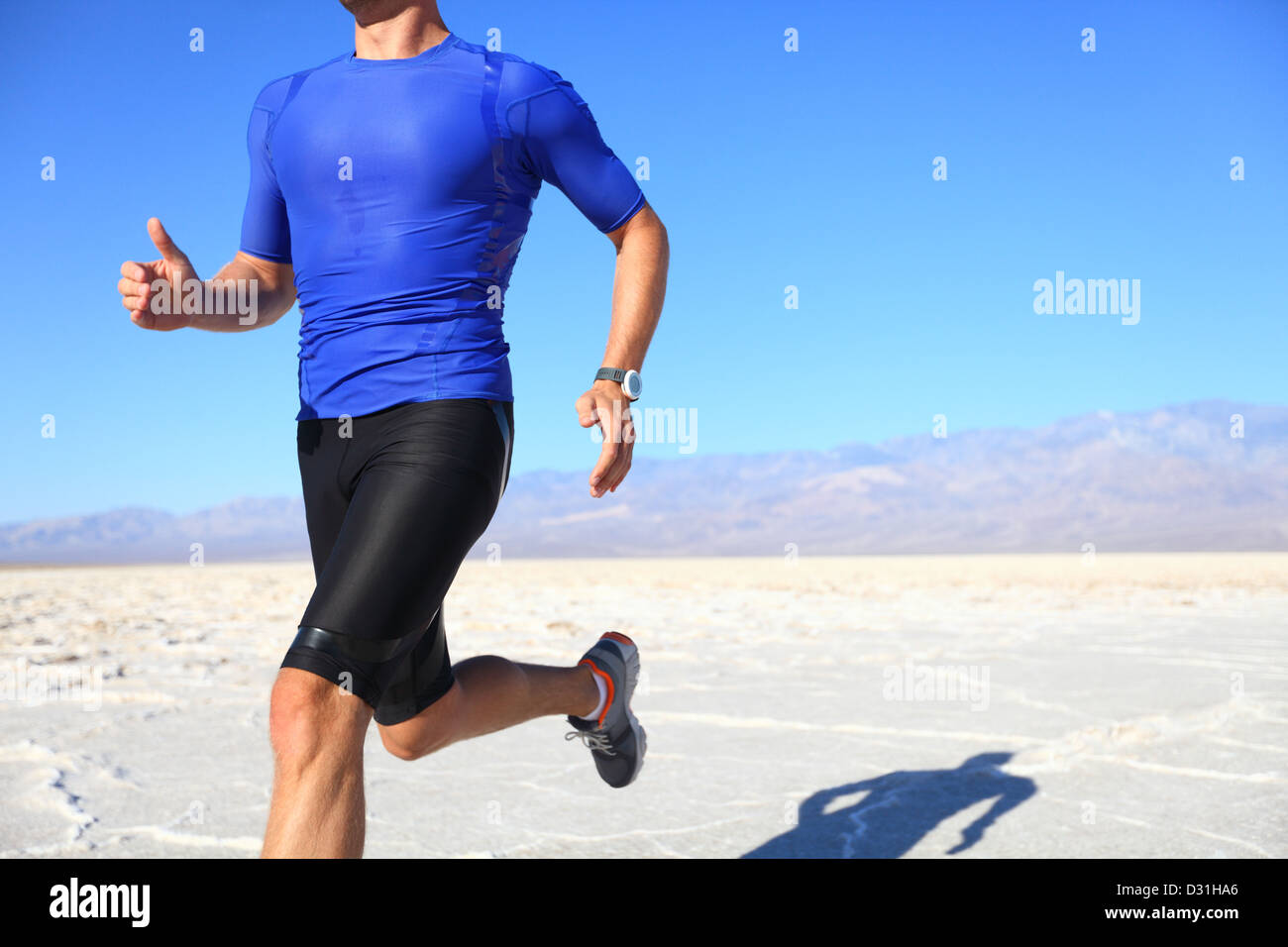 Young male athlete wearing compression clothes running and sprinting at ...