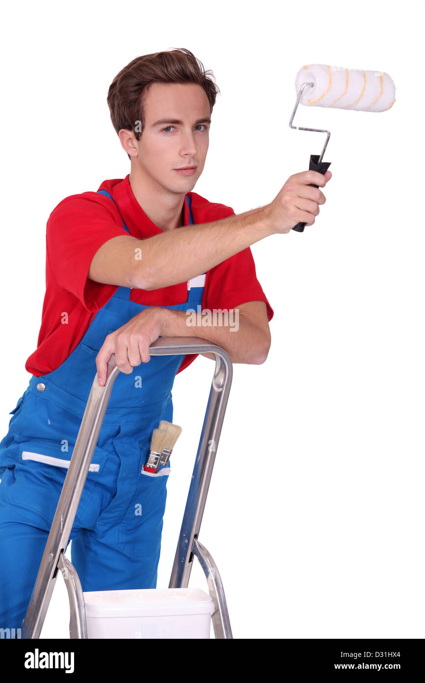 painter with roller brush standing on ladder Stock Photo - Alamy