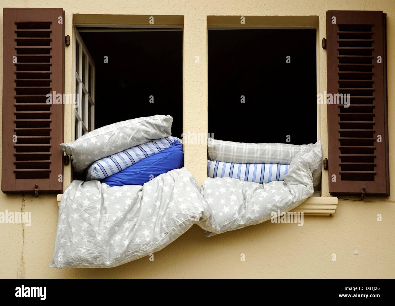 Bed linens lie on a window sill of a house in Bonn, Germany, 4 February ...