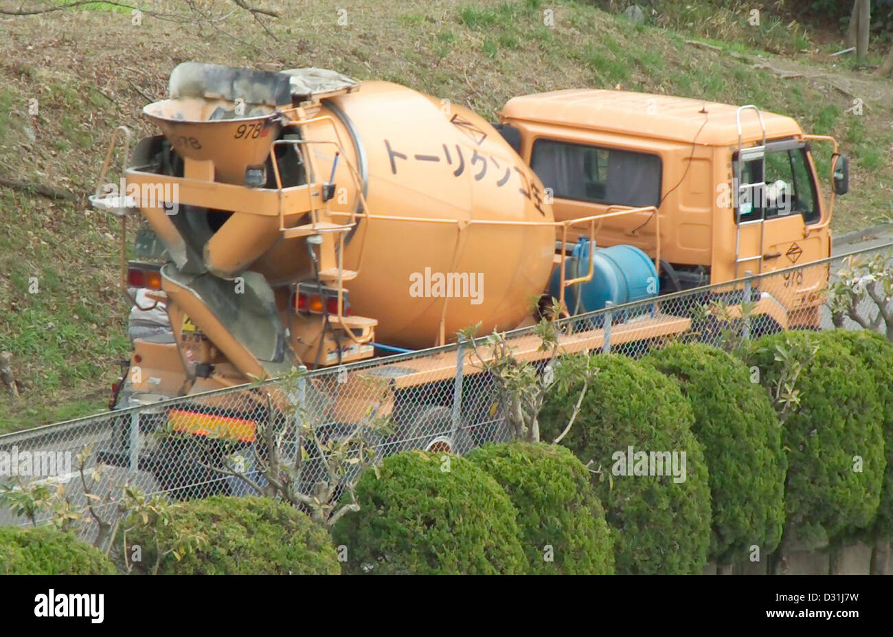 Cement mixer trucks are shown delivering concrete at a construction ...