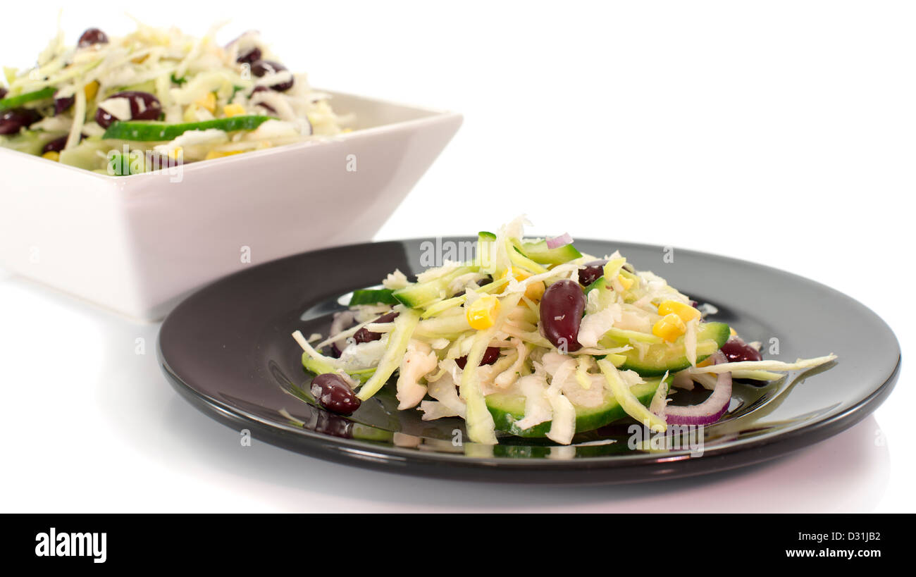 black plate with coal salad Stock Photo - Alamy