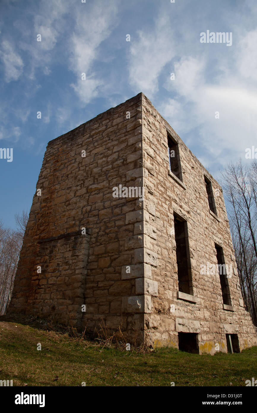 A large edifice now in ruins standing against a blue sky Stock Photo ...