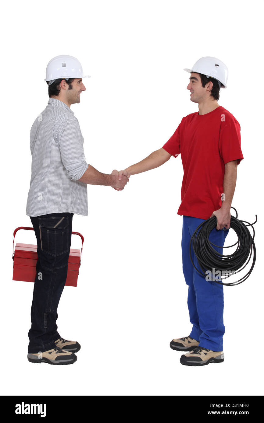 duo of electrician shaking hands Stock Photo - Alamy