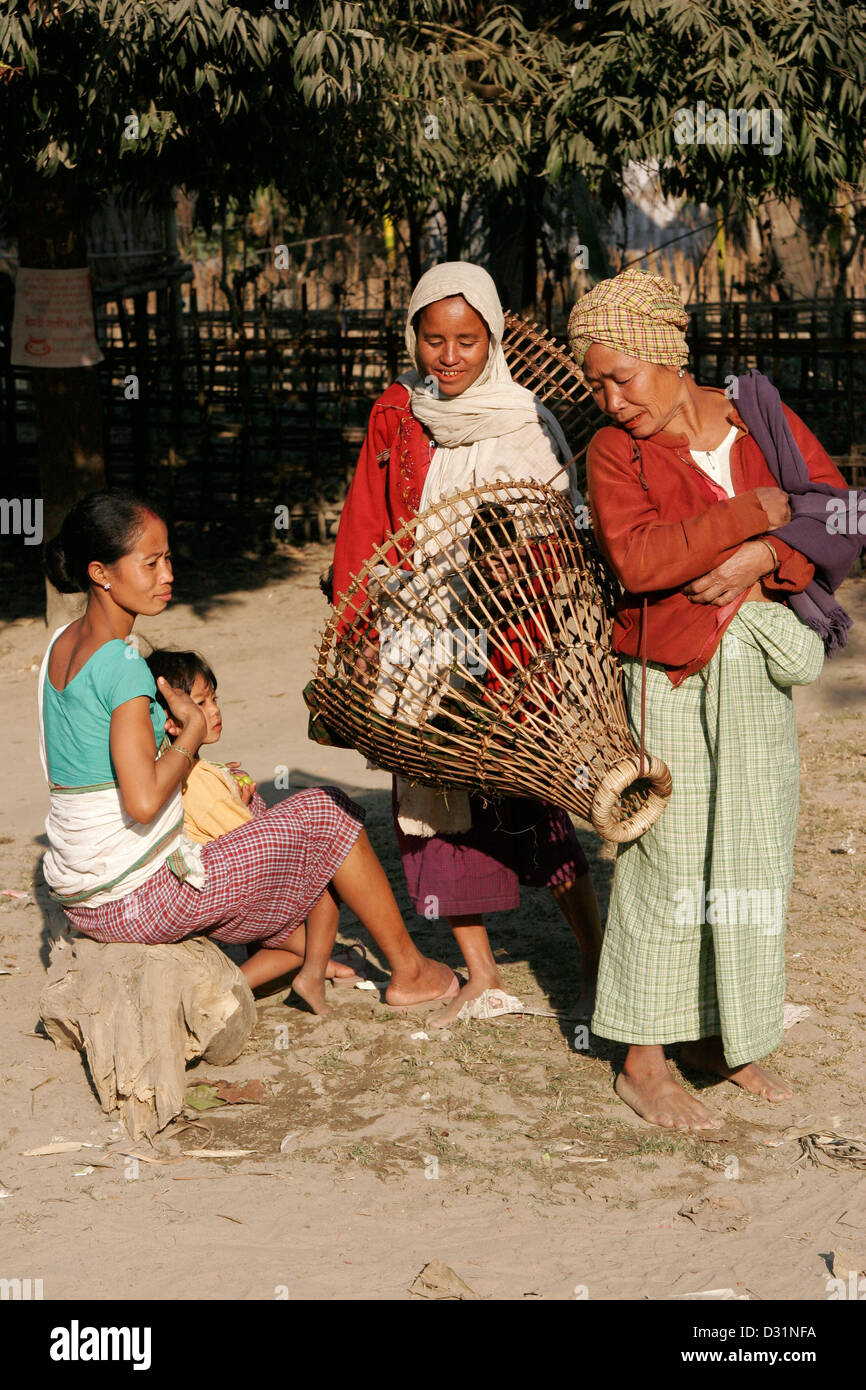 Woman from mishing tribe carrying fishing trap, Majuli Island, Assam ...