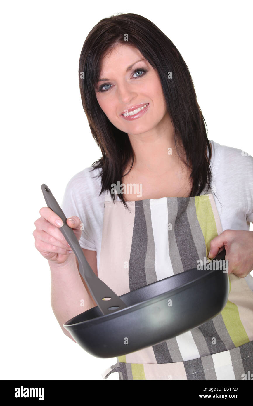 Brunette woman with pan Stock Photo - Alamy