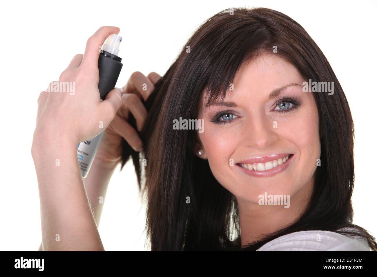 Woman applying hairspray Stock Photo - Alamy