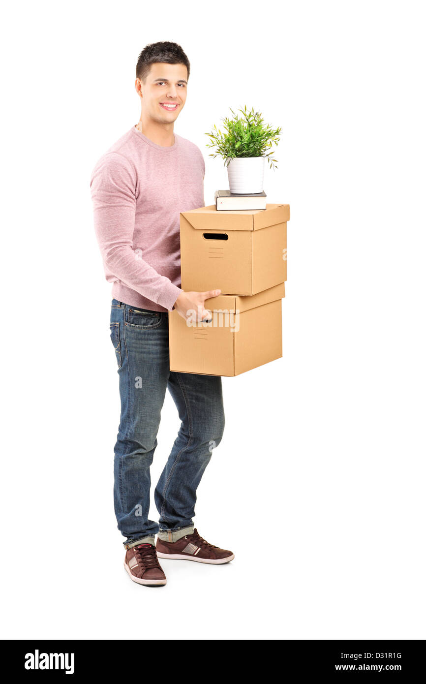 Full length portrait of a young man carrying removal boxes isolated on ...