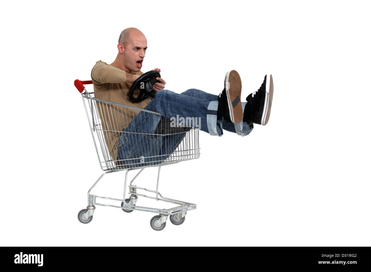 Man driving a shopping trolley Stock Photo - Alamy