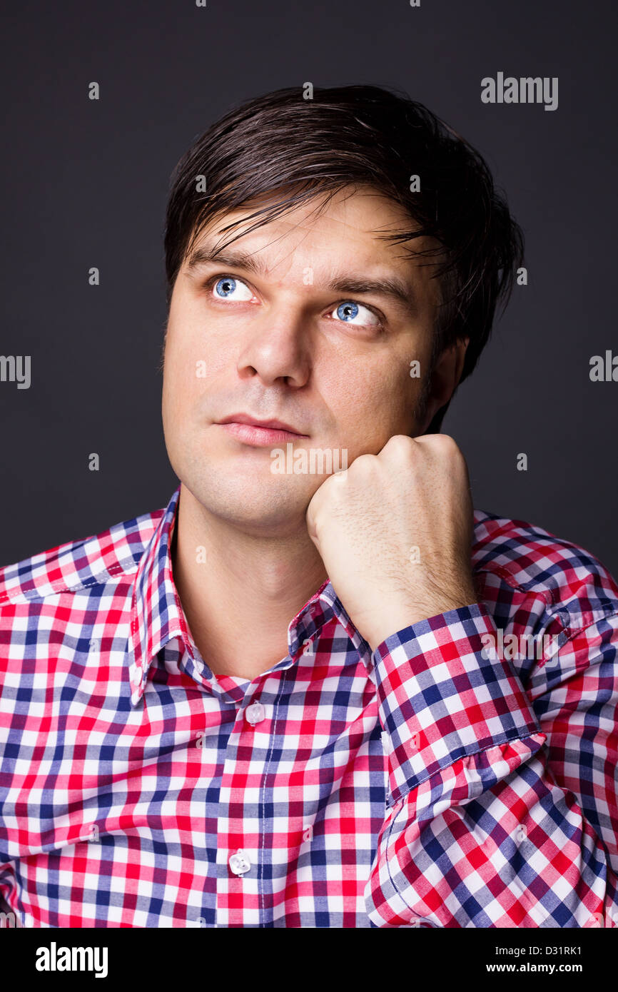 Closeup portrait of a man thinking about a problem on grey background ...