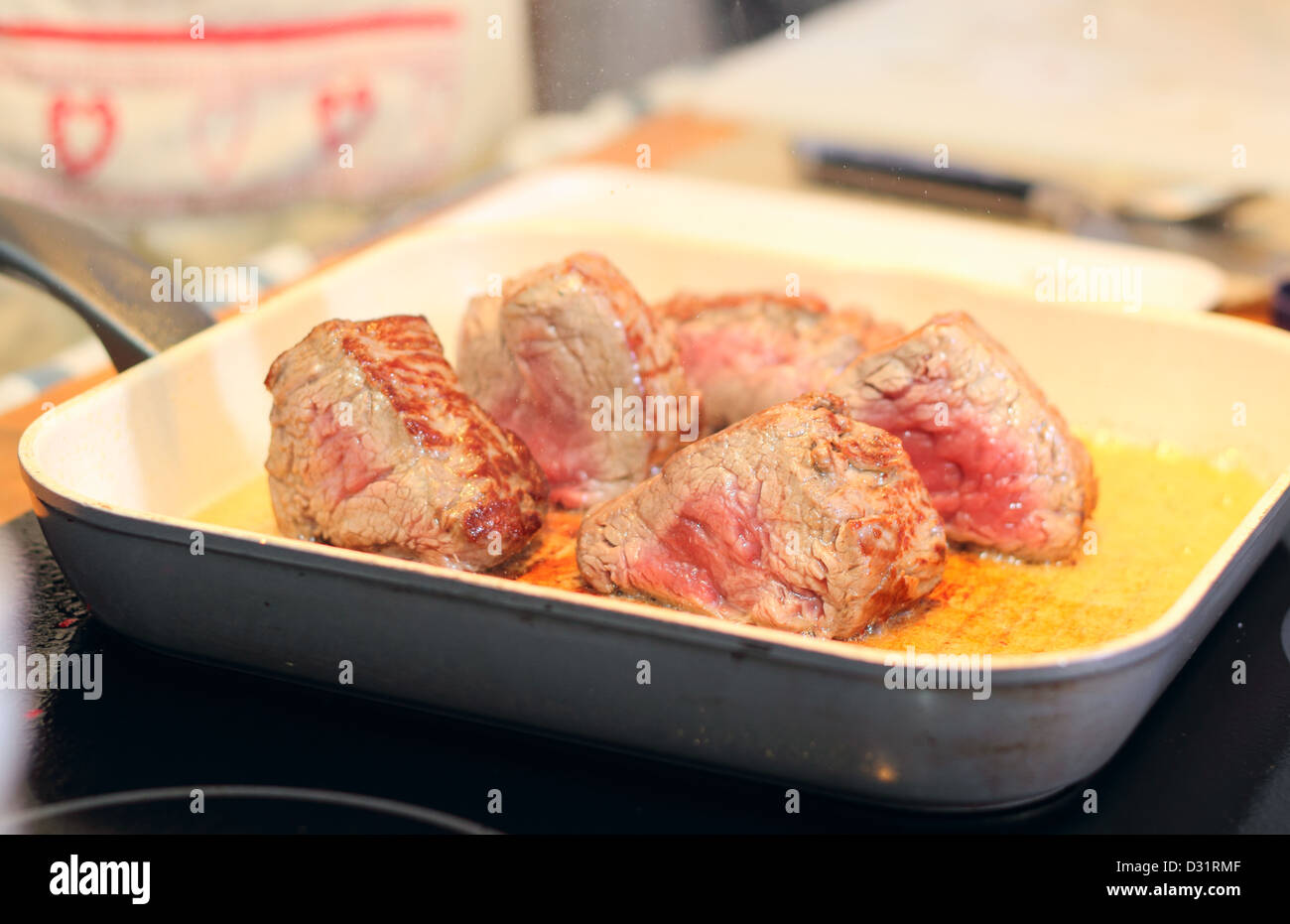 Steak slices roasted on griddle Stock Photo - Alamy