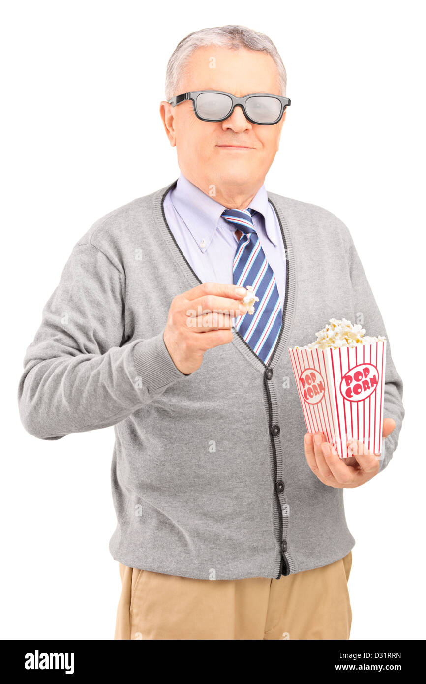 Mature gentleman eating popcorn isolated on white background Stock ...