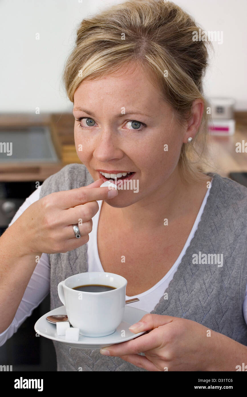 Woman Eating Sugar Cube High Resolution Stock Photography and Images ...