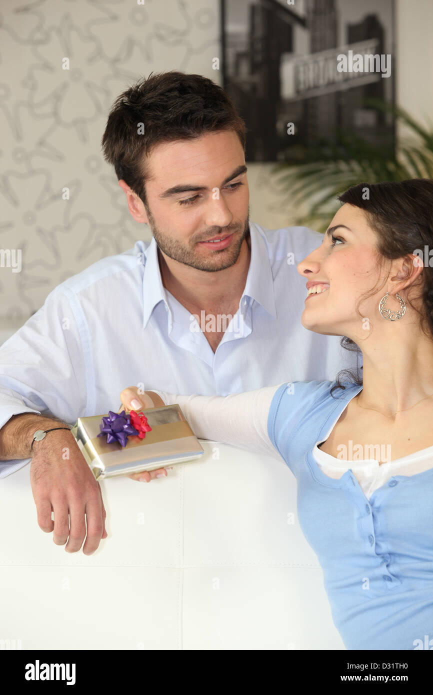 Man giving his partner gift Stock Photo - Alamy