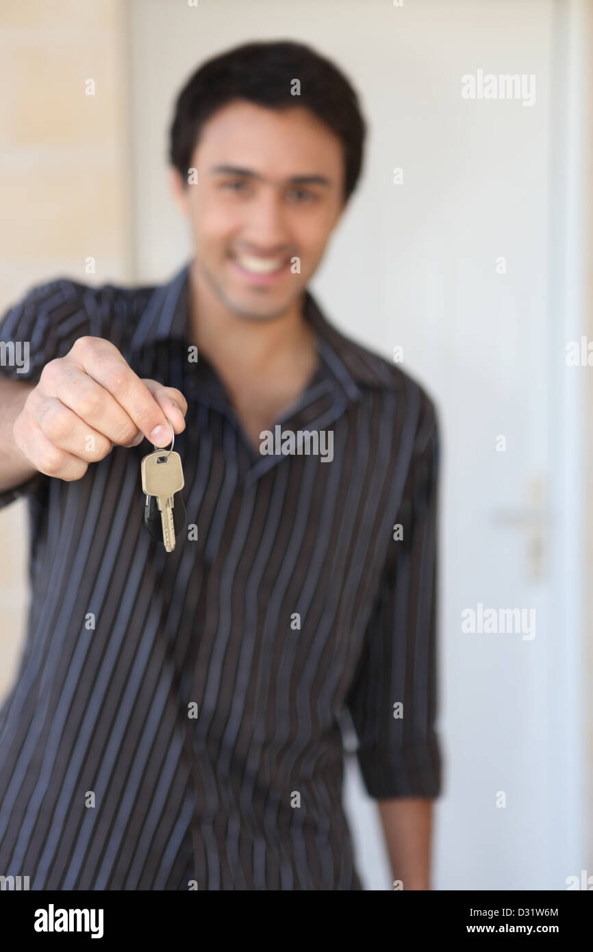 Man holding house keys Stock Photo - Alamy