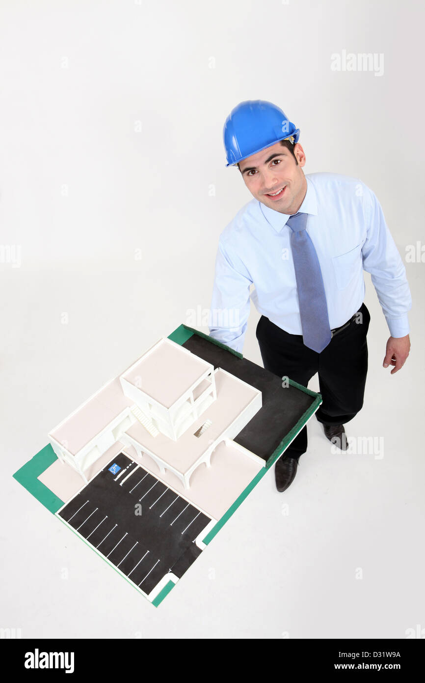 Architect presenting his miniature Stock Photo - Alamy