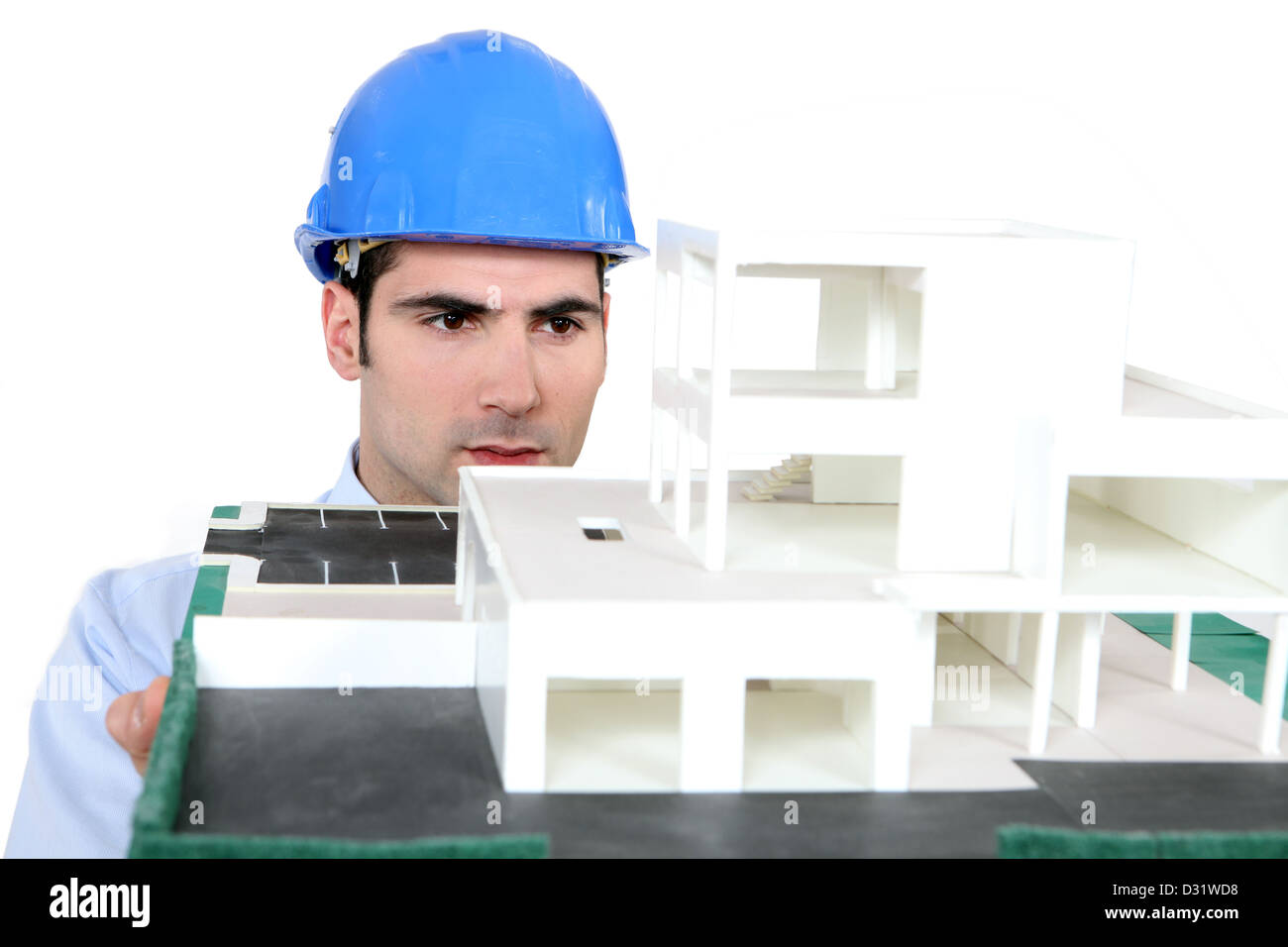 Architect holding his building model Stock Photo - Alamy