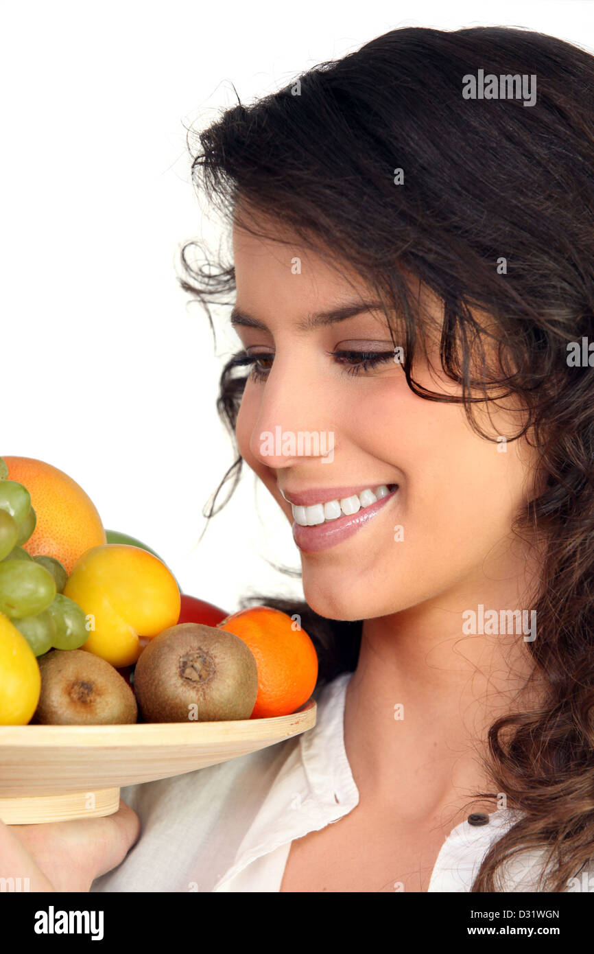 Woman carrying fruit Stock Photo - Alamy