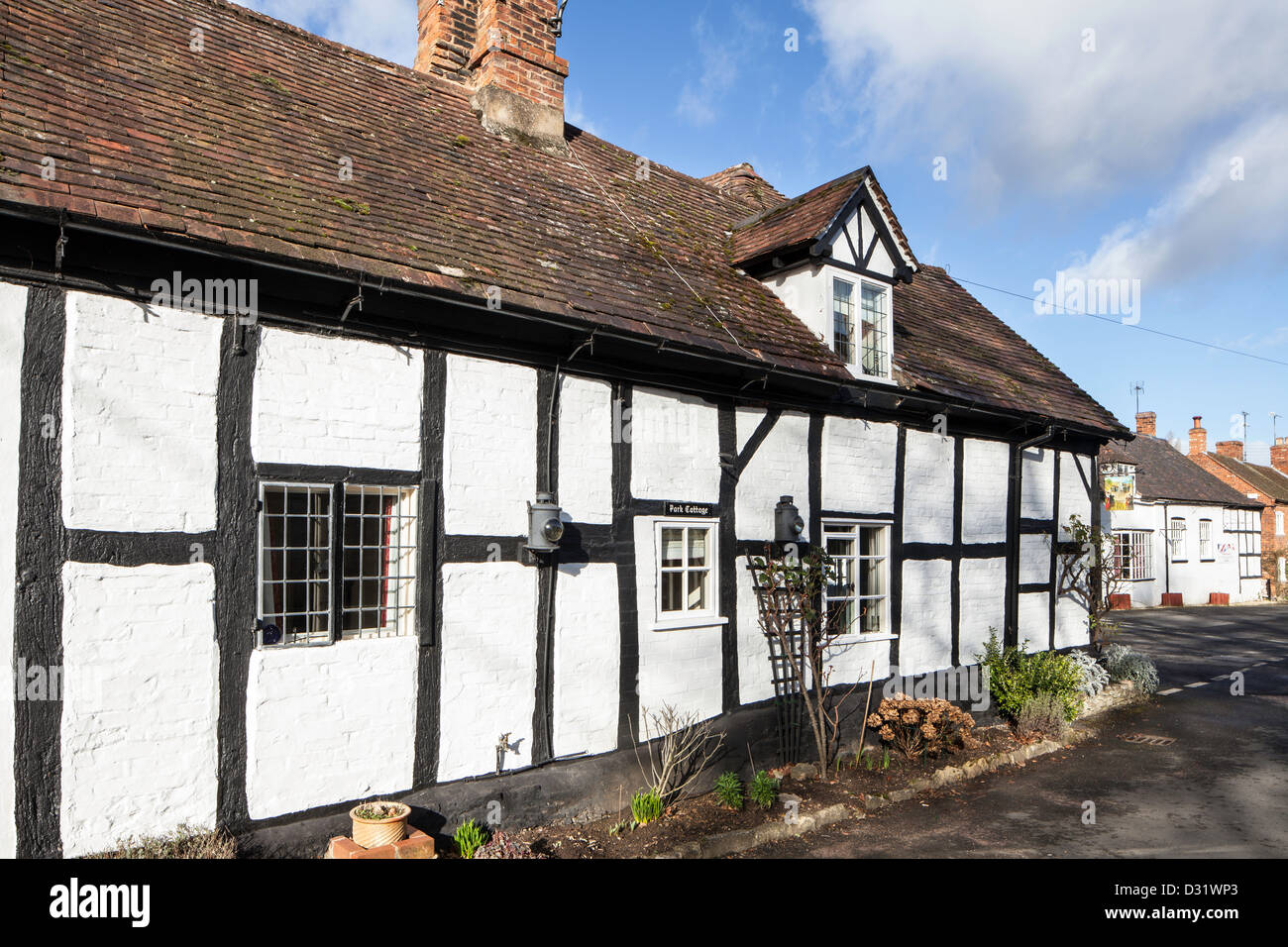Half timbered thatched cottage in the village of Bredon, Worcestershire ...