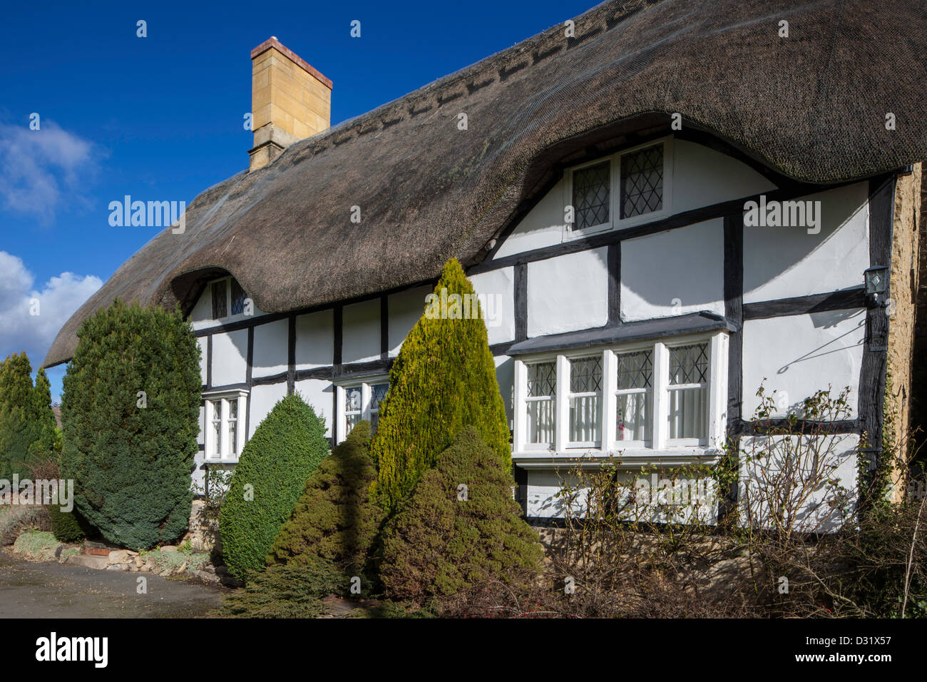 Half timbered thatched cottage in the village of Bredon, Worcestershire ...